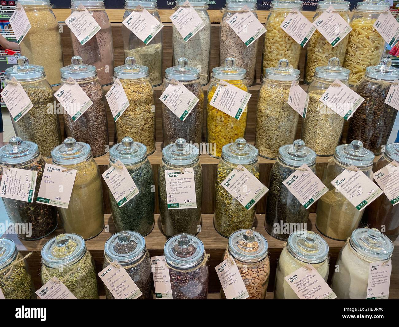 Organic food such as lentils , Tea leaves and dry fruits stored in jars ...