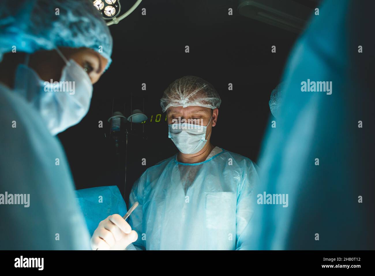 An international professional team of surgeon, assistants and ...