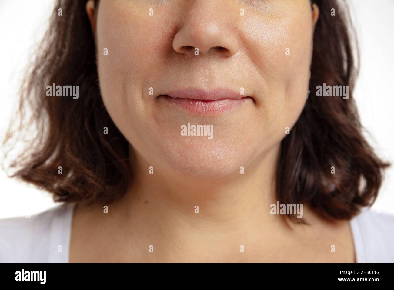 Close-up of female mouth with closed lips without makeup. Anti-aged ...