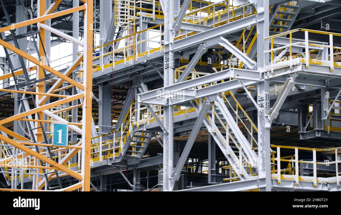 Scaffolding installation at a tank with process structures of refinery ...