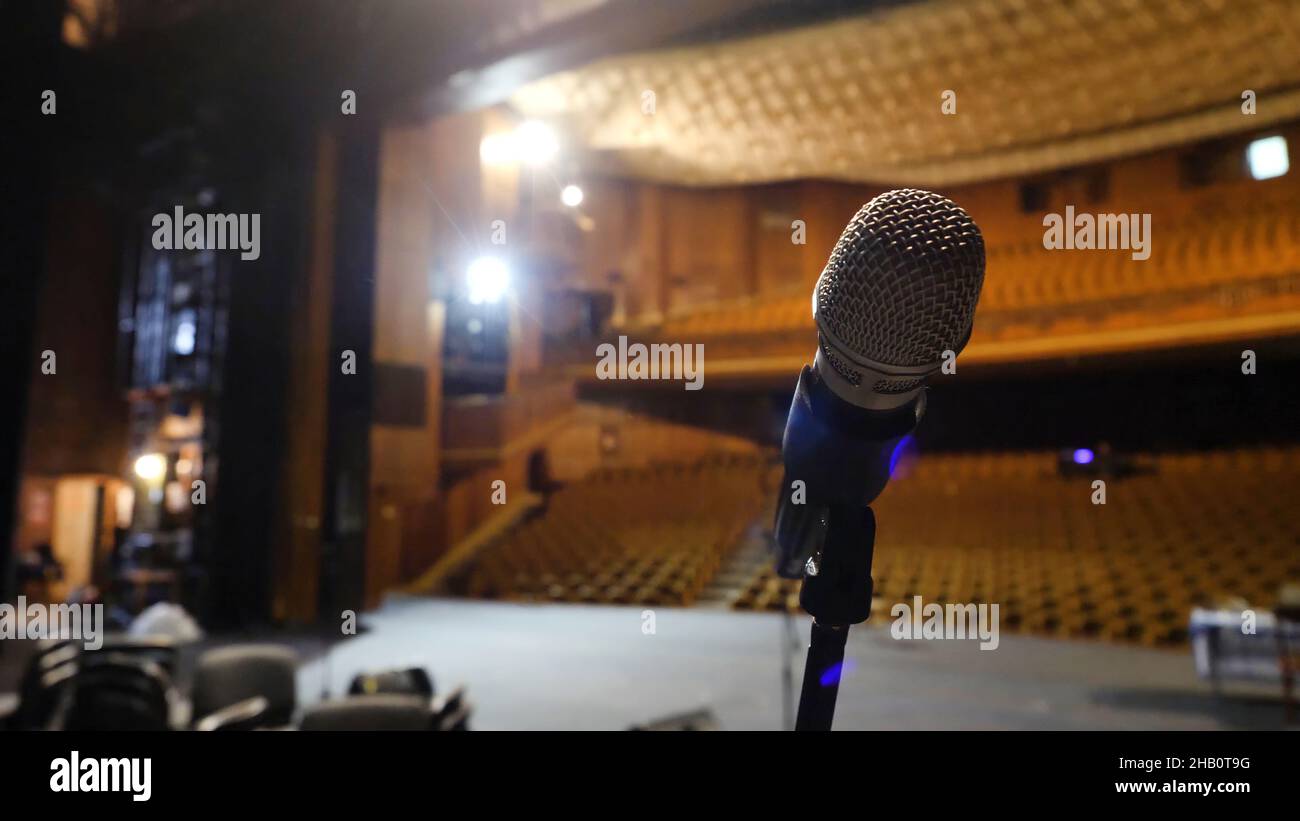 Microphone on the stage and empty hall during the rehearsal. Microphone ...