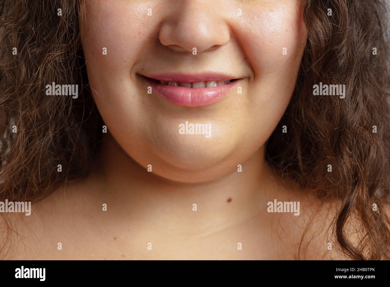 Close-up cropped female face. Mouth, nose and chin. Anti-aged ...