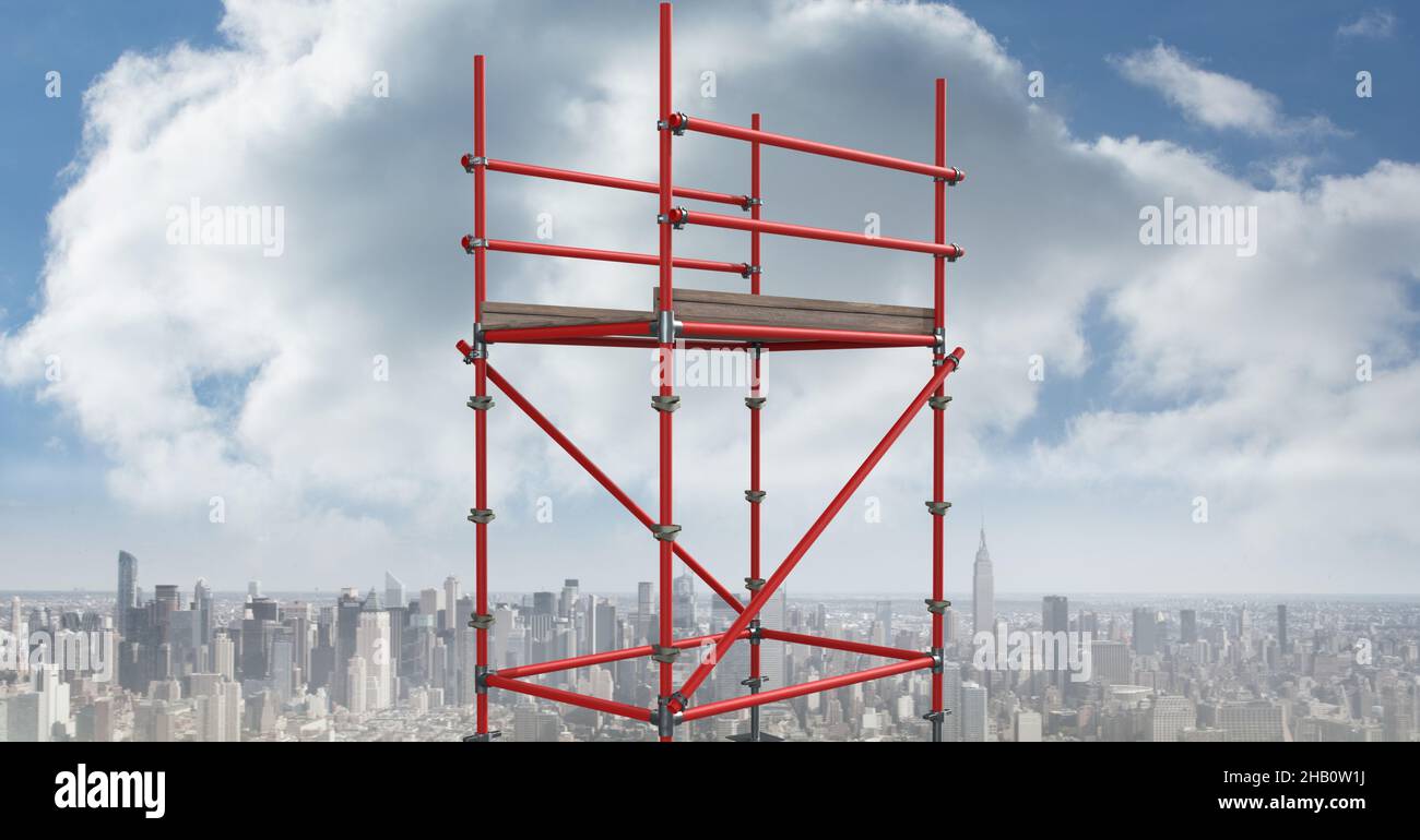 Construction scaffolding over a cityscape against clouds in the blue ...