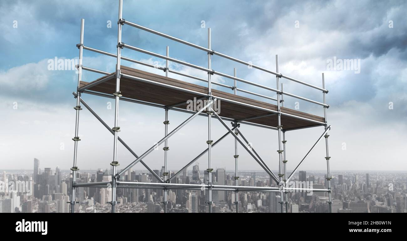 Construction scaffolding over a cityscape against clouds in the blue ...
