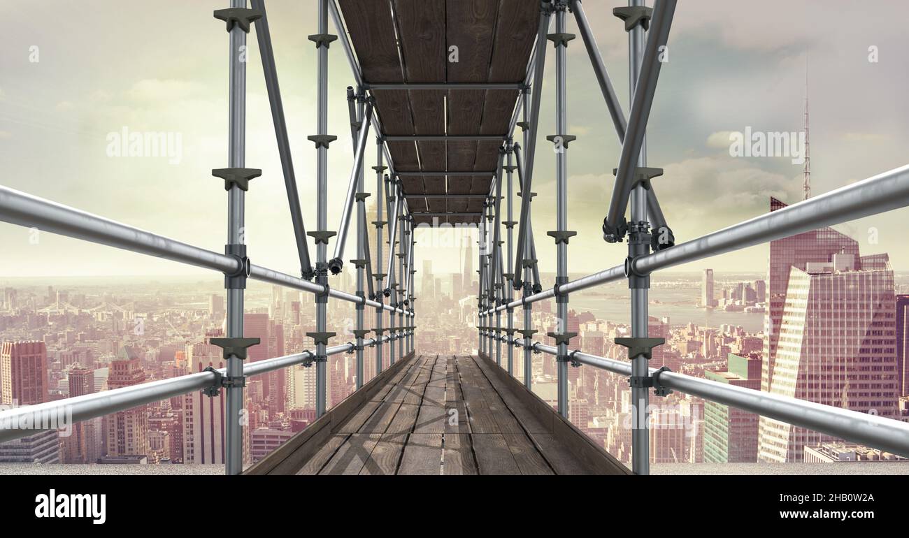 Construction scaffolding over a cityscape against clouds in the blue ...