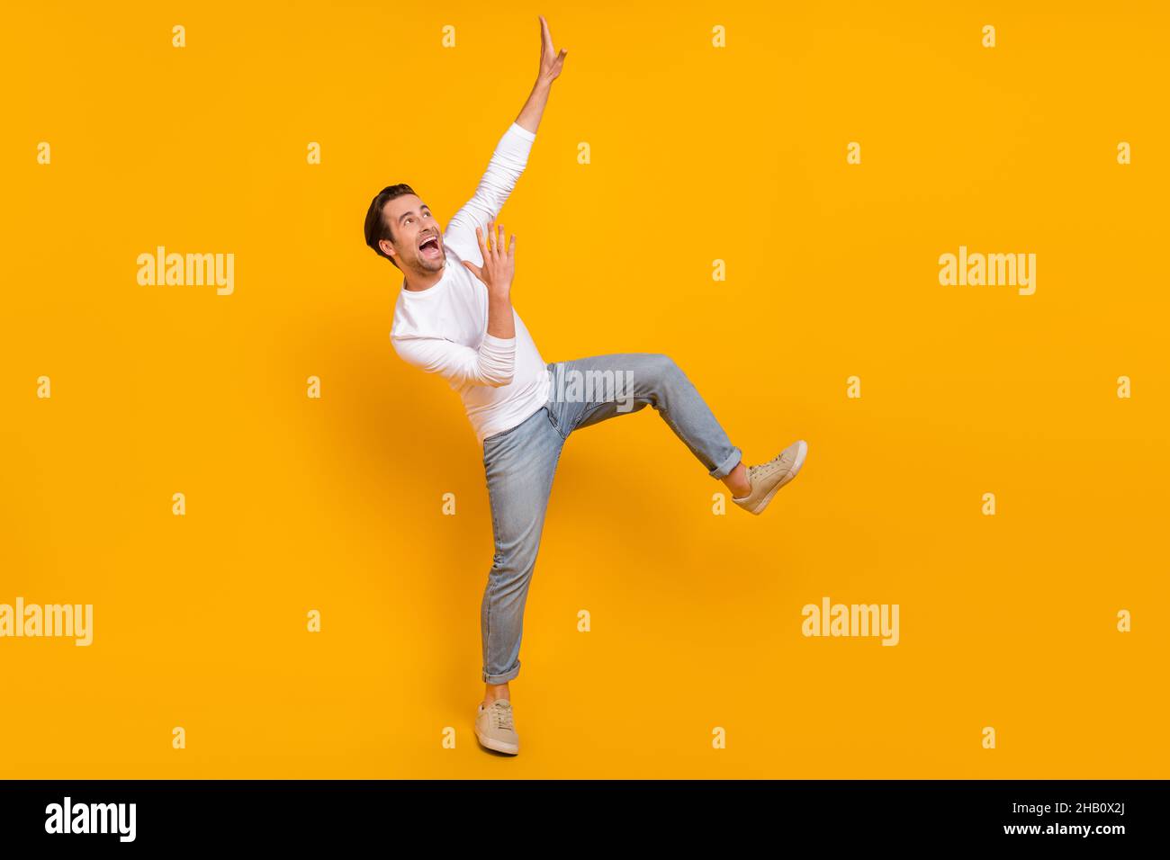 Full length photo of cool brunet young guy dance look promo wear shirt ...