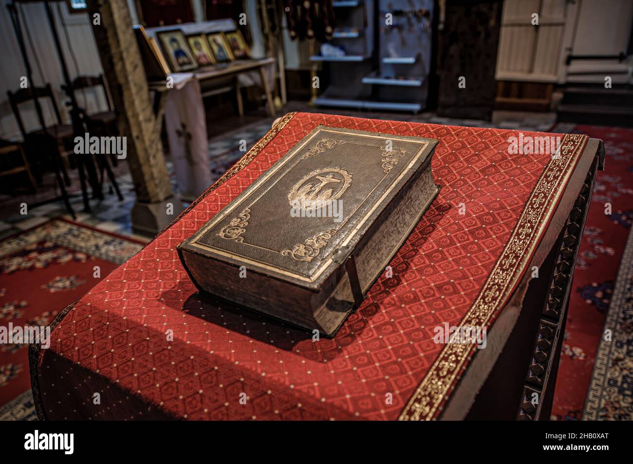 Detail view of authentic ancient old holy bible book on altar in church ...