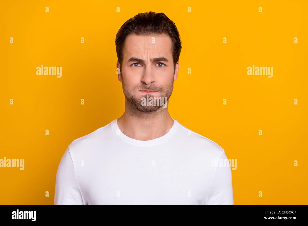 Photo of youngster man pouted cheeks grimace hold breath humorous ...