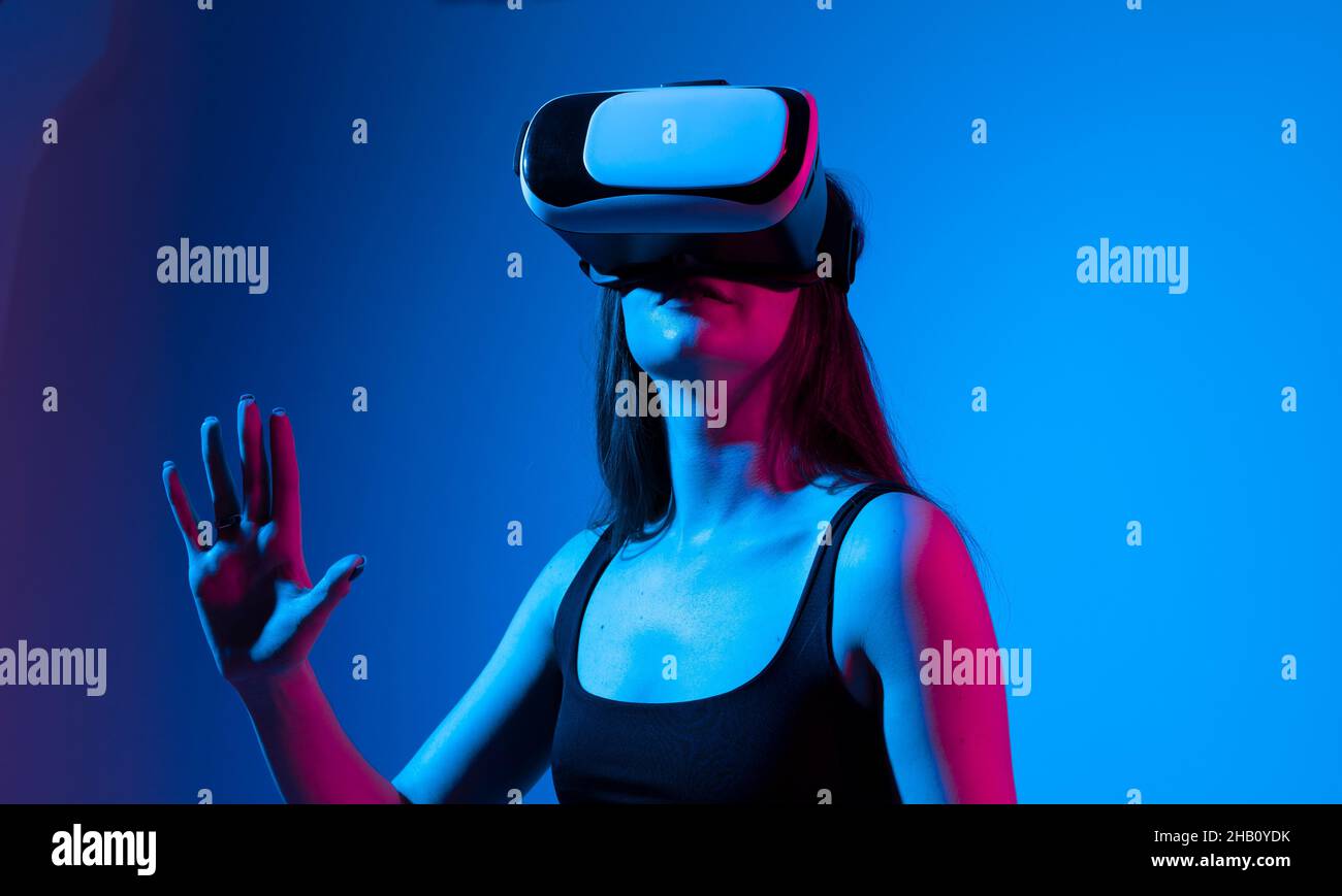 Female engineer wearing virtual reality headset designing a new ...