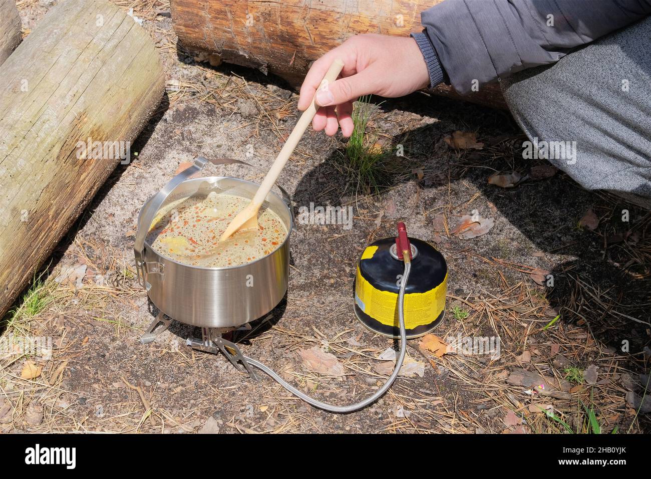 Tourist foods in outdoor activities. Soup in bowler in the forest for ...