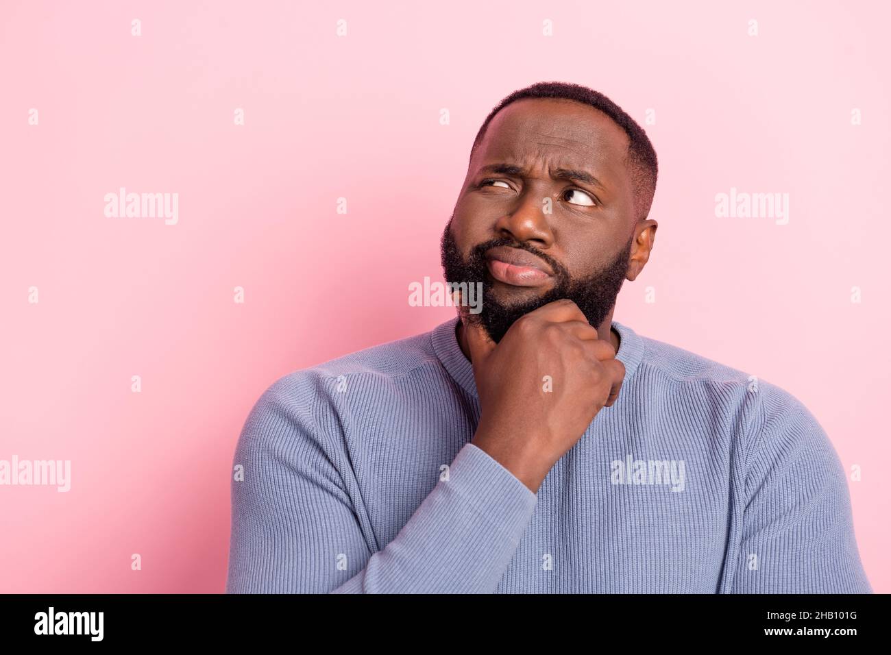 Photo of unsure clever guy look empty space finger chin think dilemma ...