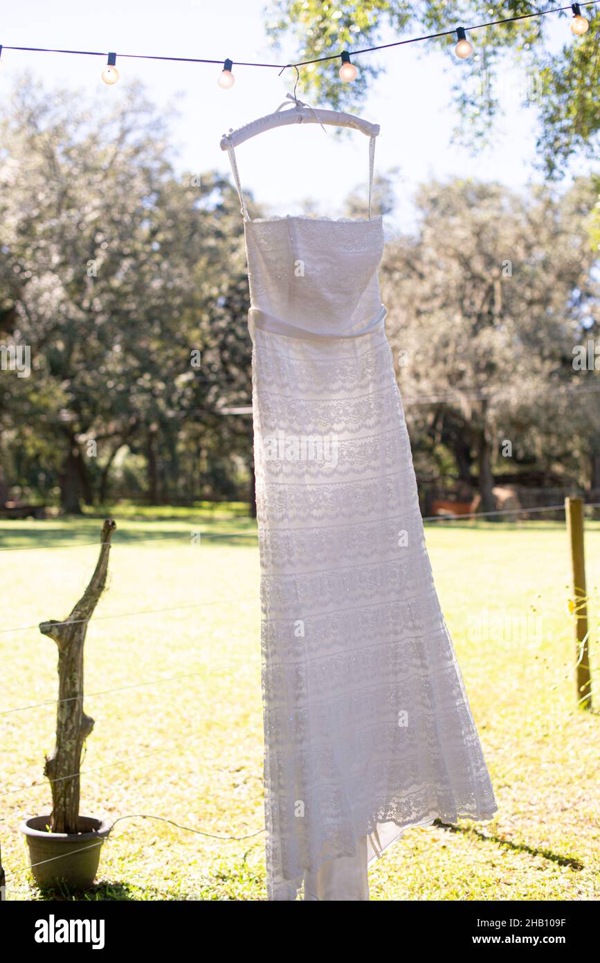 Wedding dress hanging on tree hi-res stock photography and images - Alamy