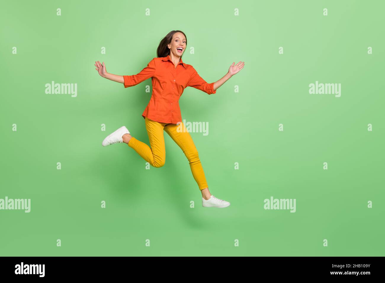Full length photo of young lovely excited lady have fun jump fly ...