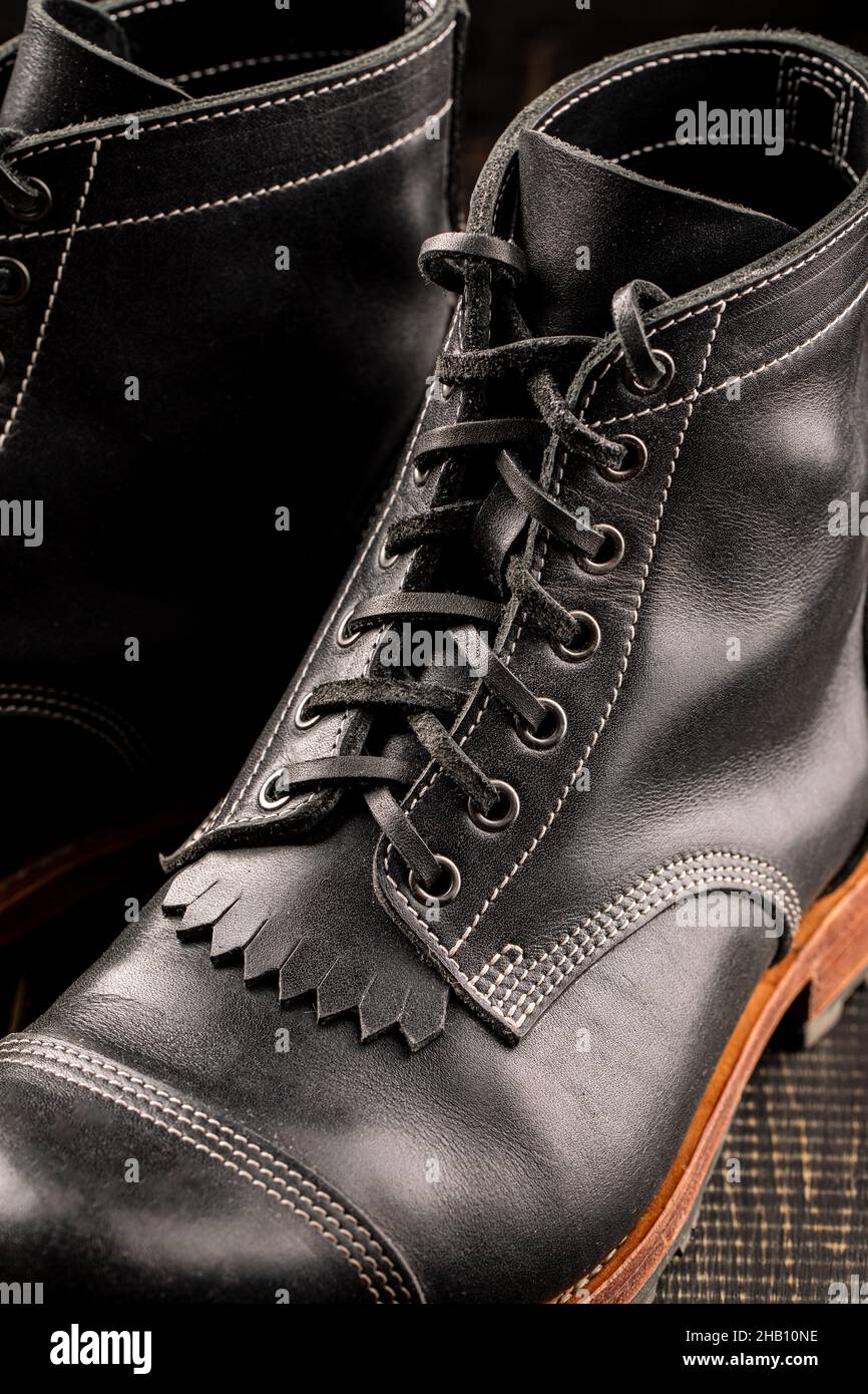 Hand crafted black leather high boots Stock Photo - Alamy