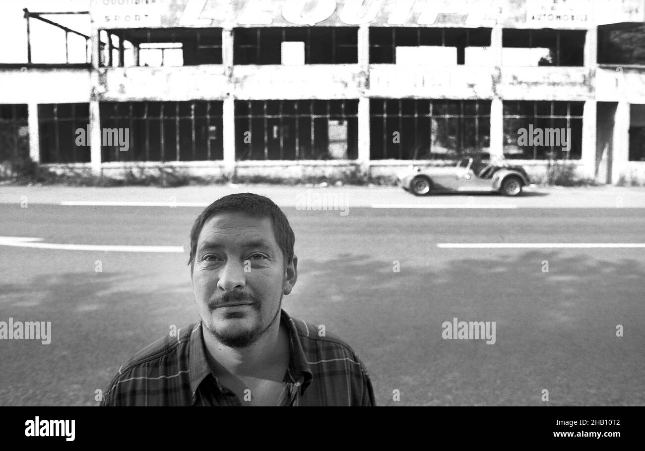 Chris Rea with his Caterham7 race car at the old Reims race track ...