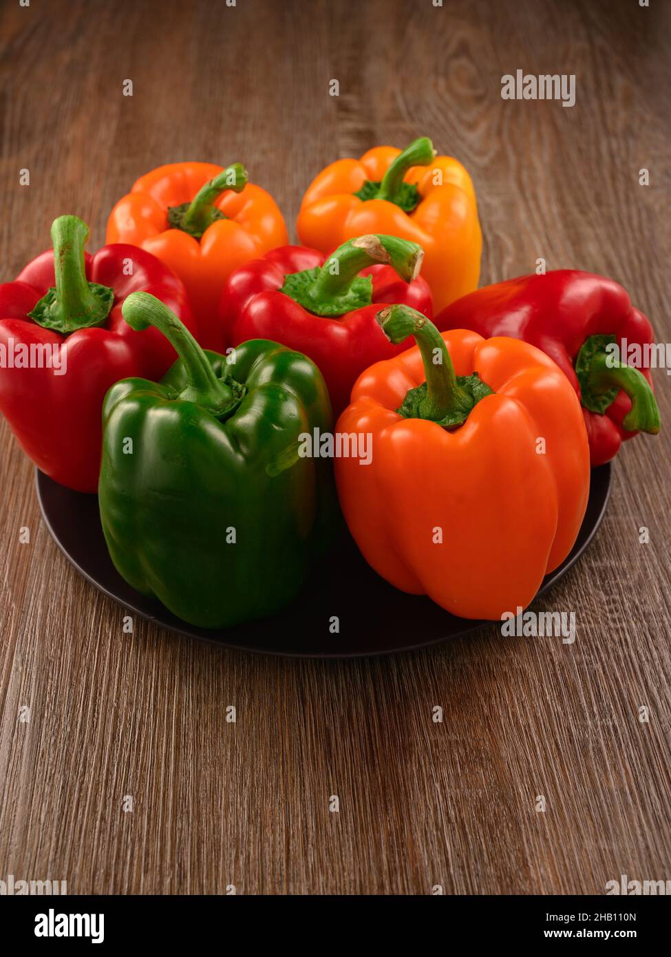 Photo shows peppers in three colors: yellow, red and green. Photo was ...