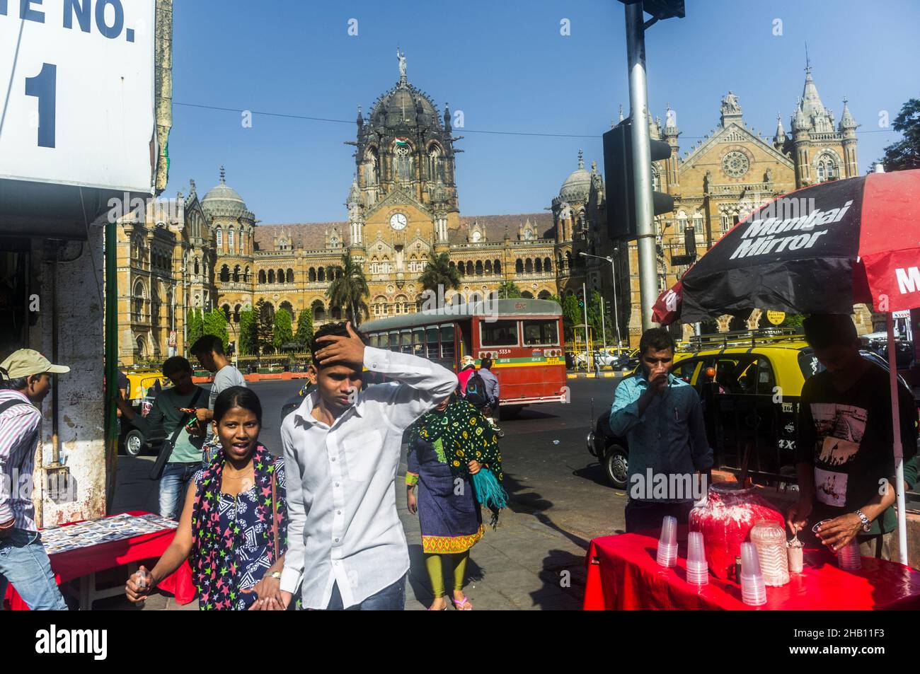 Mumbai, Maharashtra, India : People walk past a cold drinks stall in ...