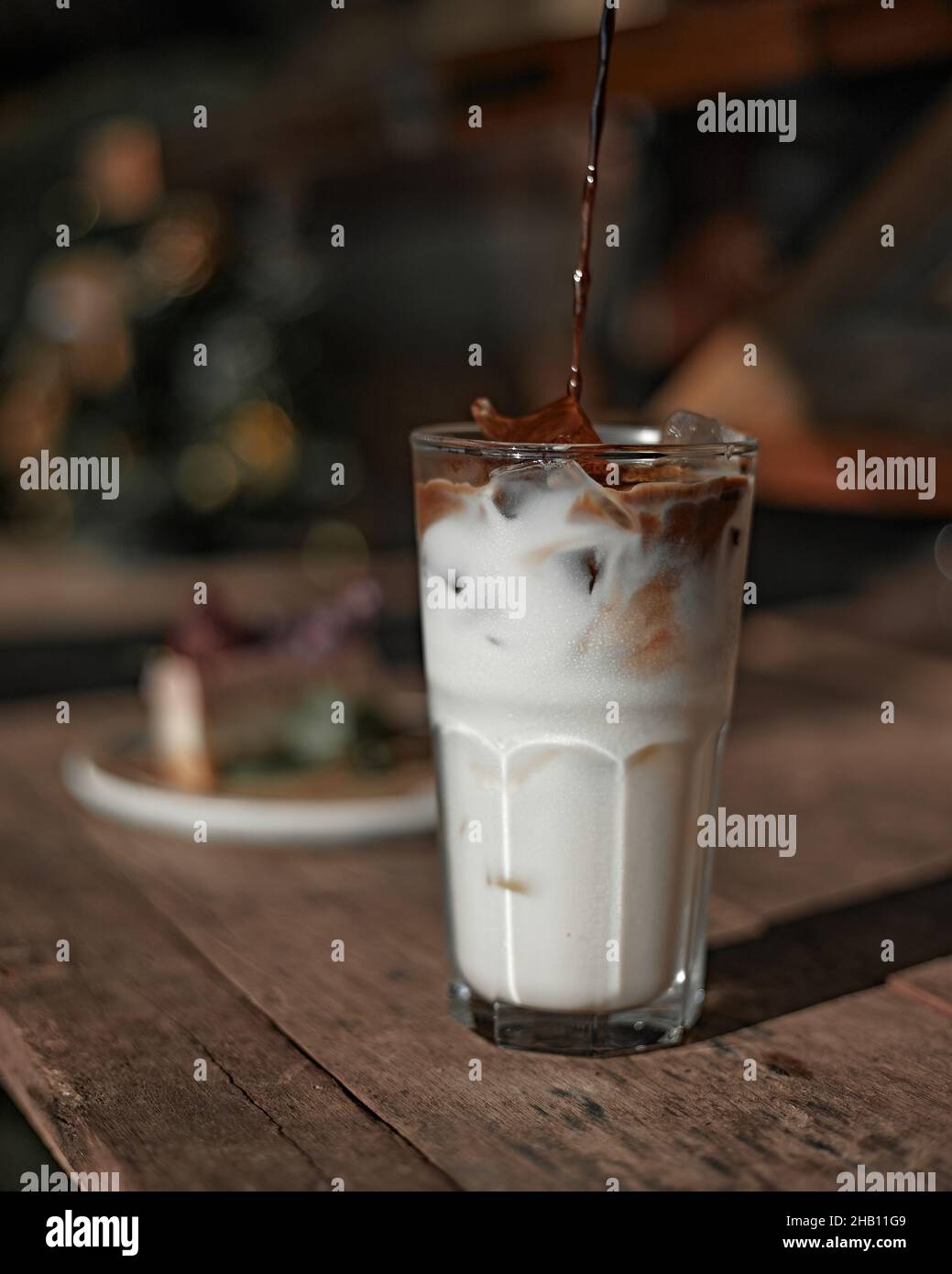 iced latte coffee in a glass with cold milk Stock Photo - Alamy