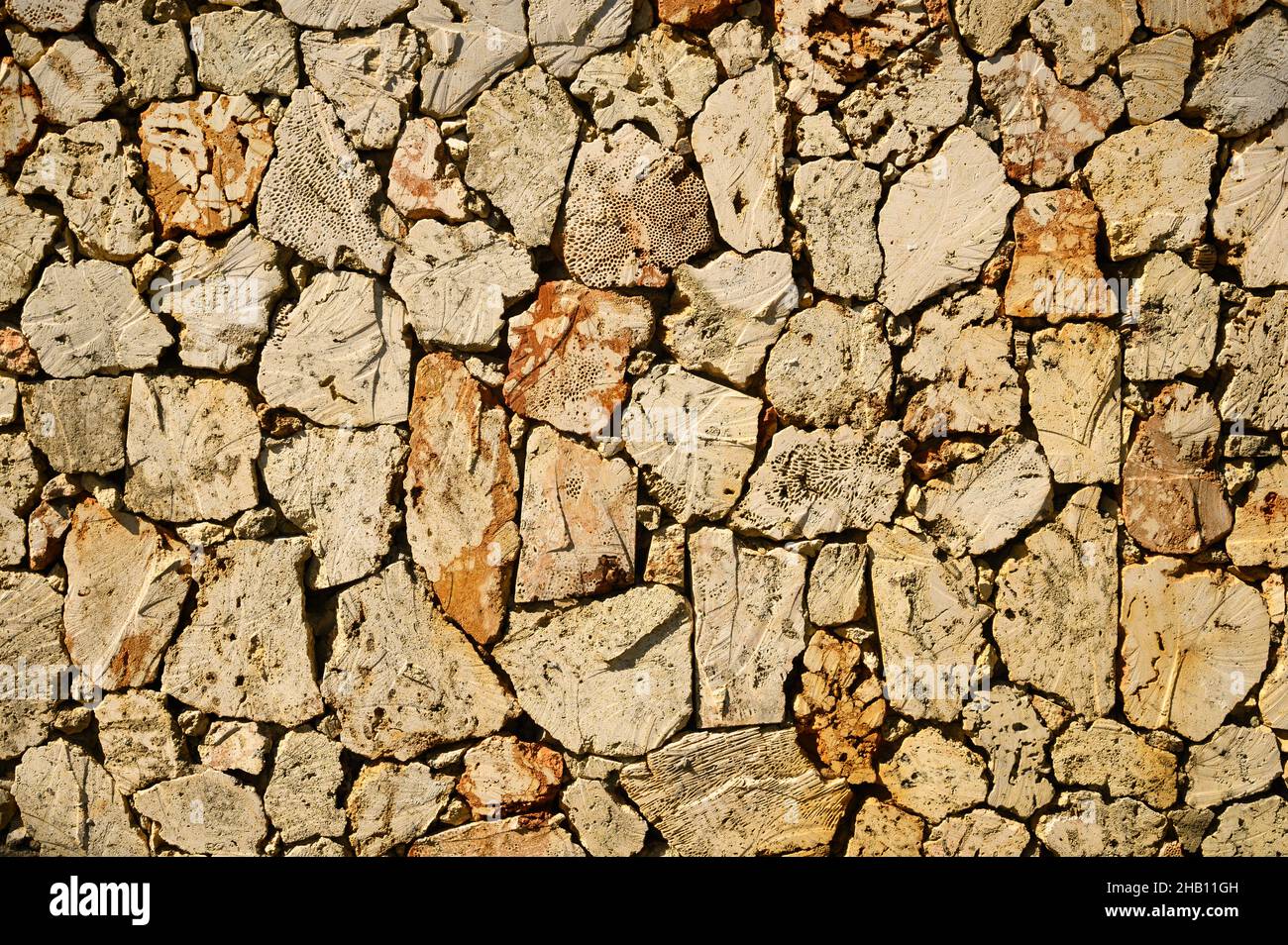 The photo shows a stone wall; the delimitation of the natural stone of ...