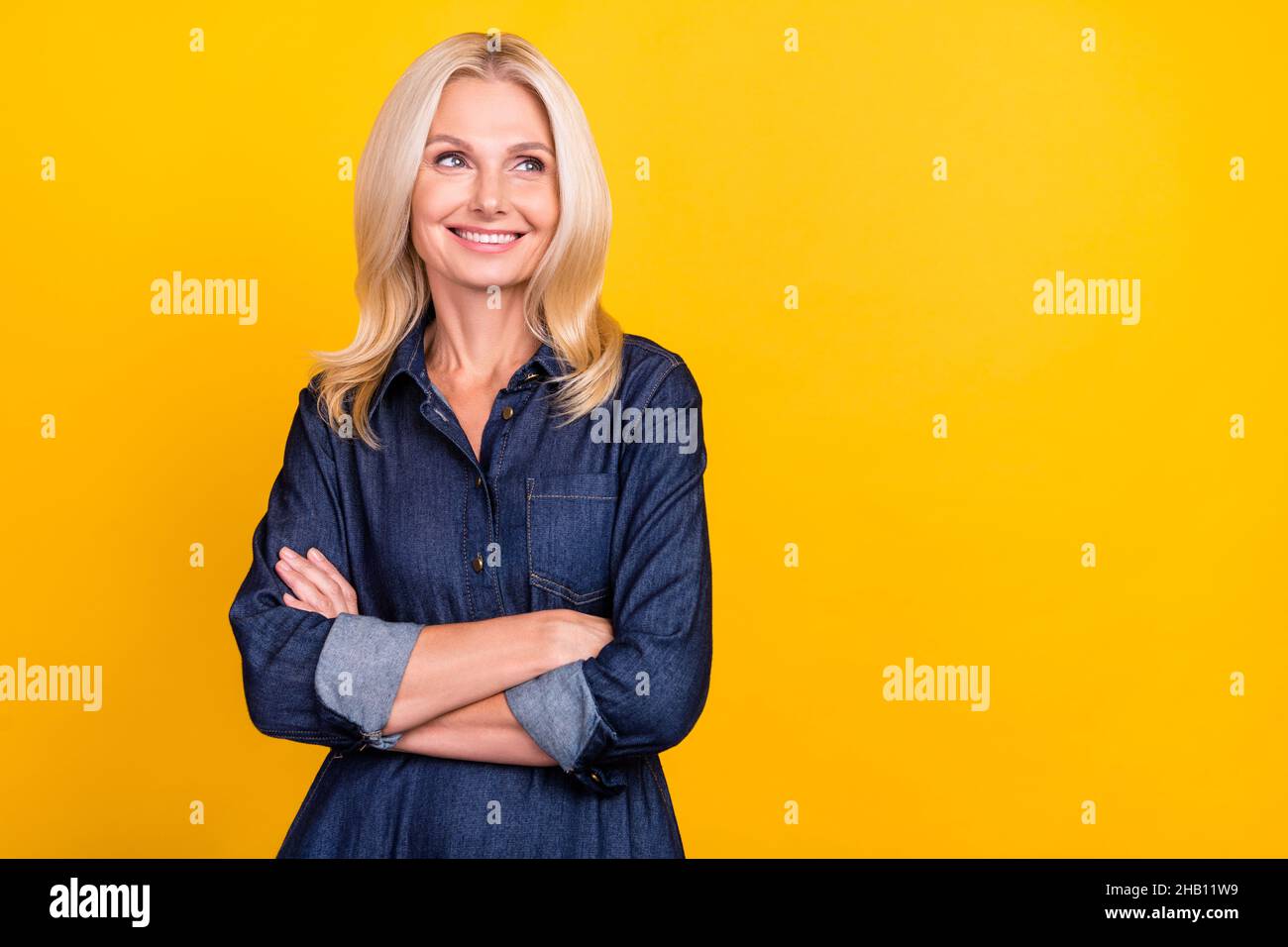 Photo of adorable cute lady pensioner dressed denim outfit arms crossed ...