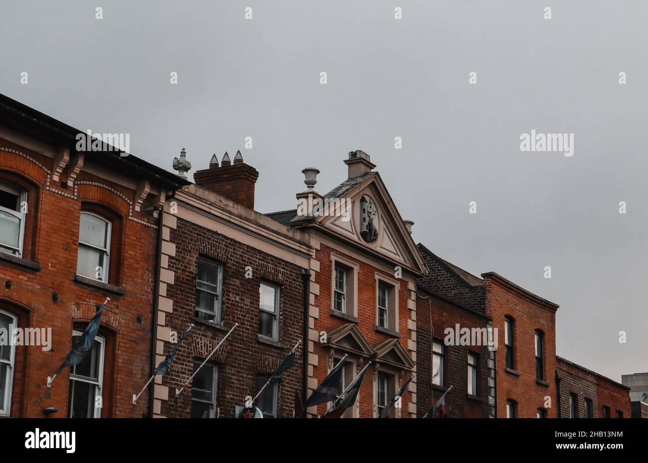Eerie scenery of an old red brick building under the gray sky on a ...