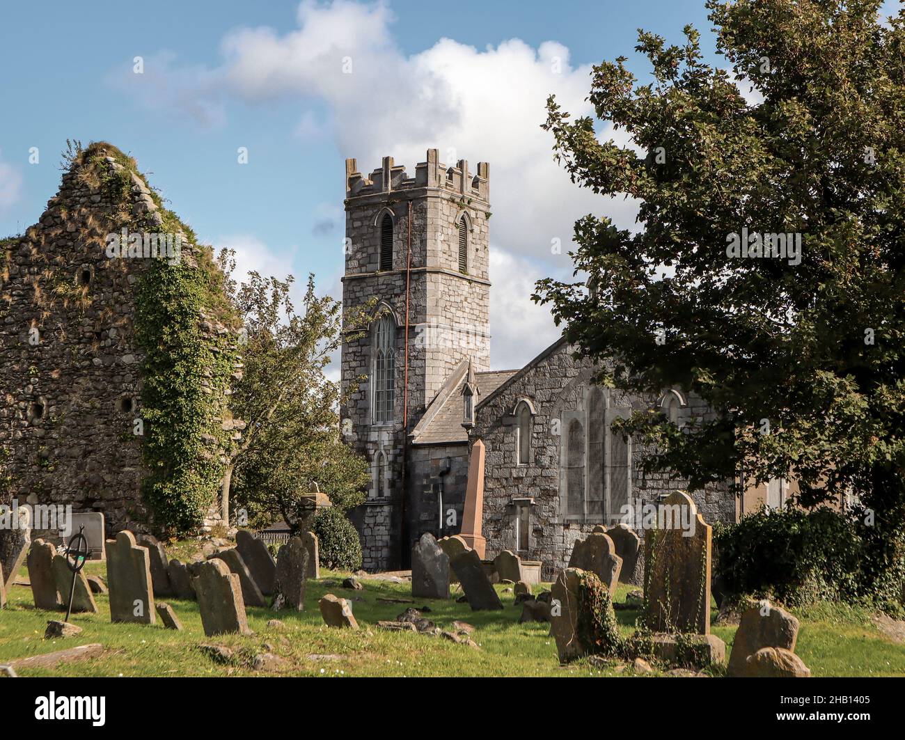 Eerie scenery of an ancient graveyard by a medieval cathedral in ...