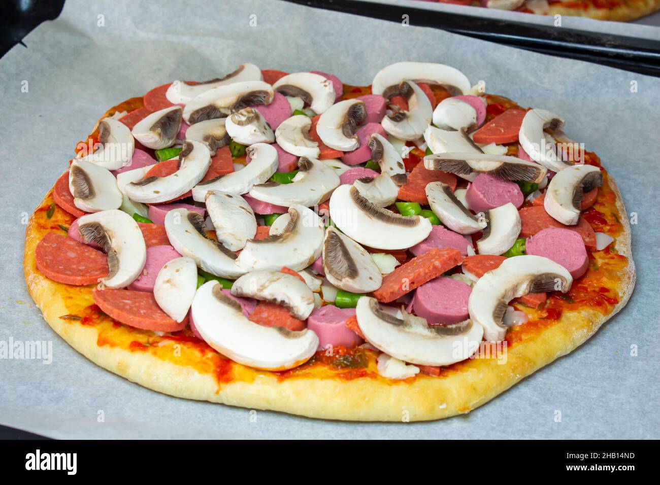 Top view uncooked pizza, homemade pizza cooking Stock Photo - Alamy