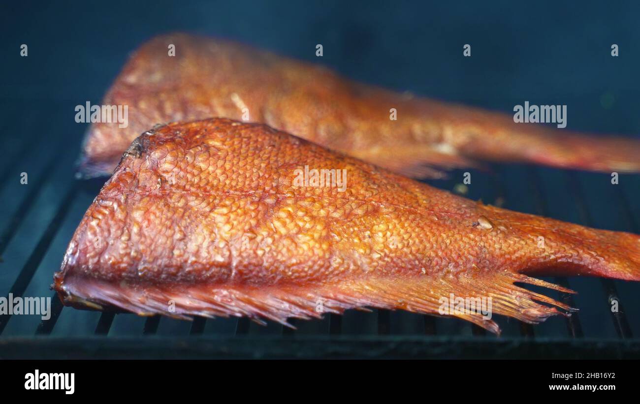 Smoked perch fish in smokehouse on the grate Stock Photo - Alamy