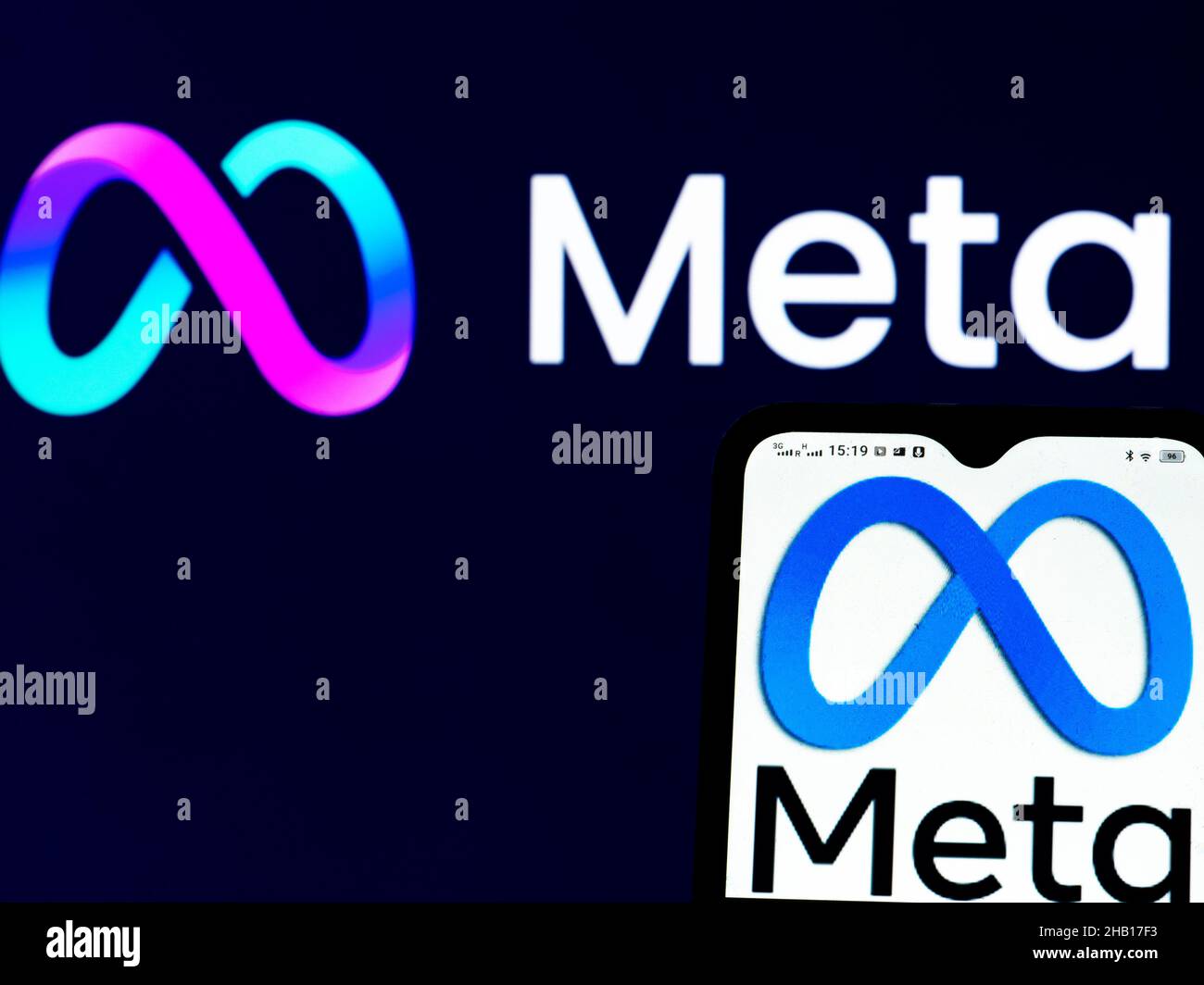 In this photo illustration a Meta Platforms Inc. logo seen displayed on a smartphone and in the ...