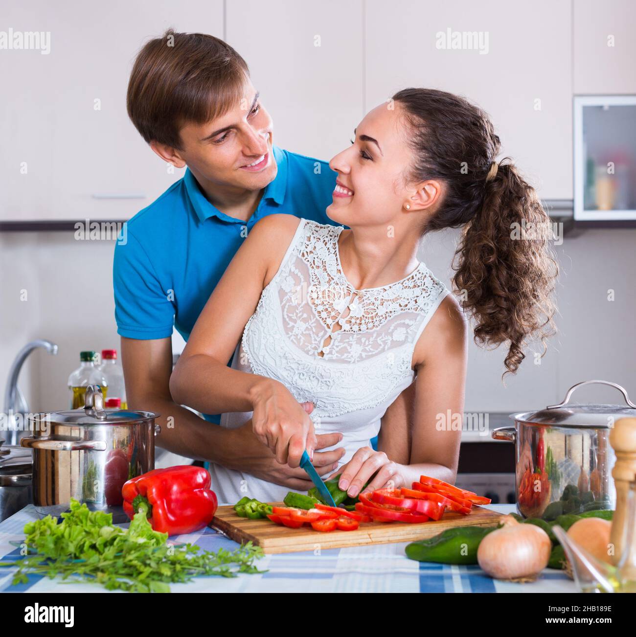Young husband helping wife hi-res stock photography and images - Alamy
