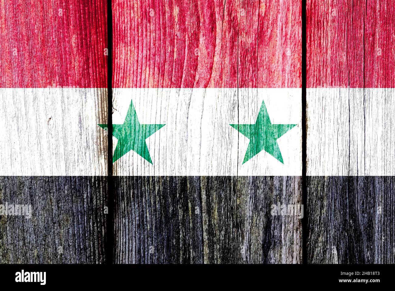 Grunge pattern of Syria national flag isolated on weathered wooden ...