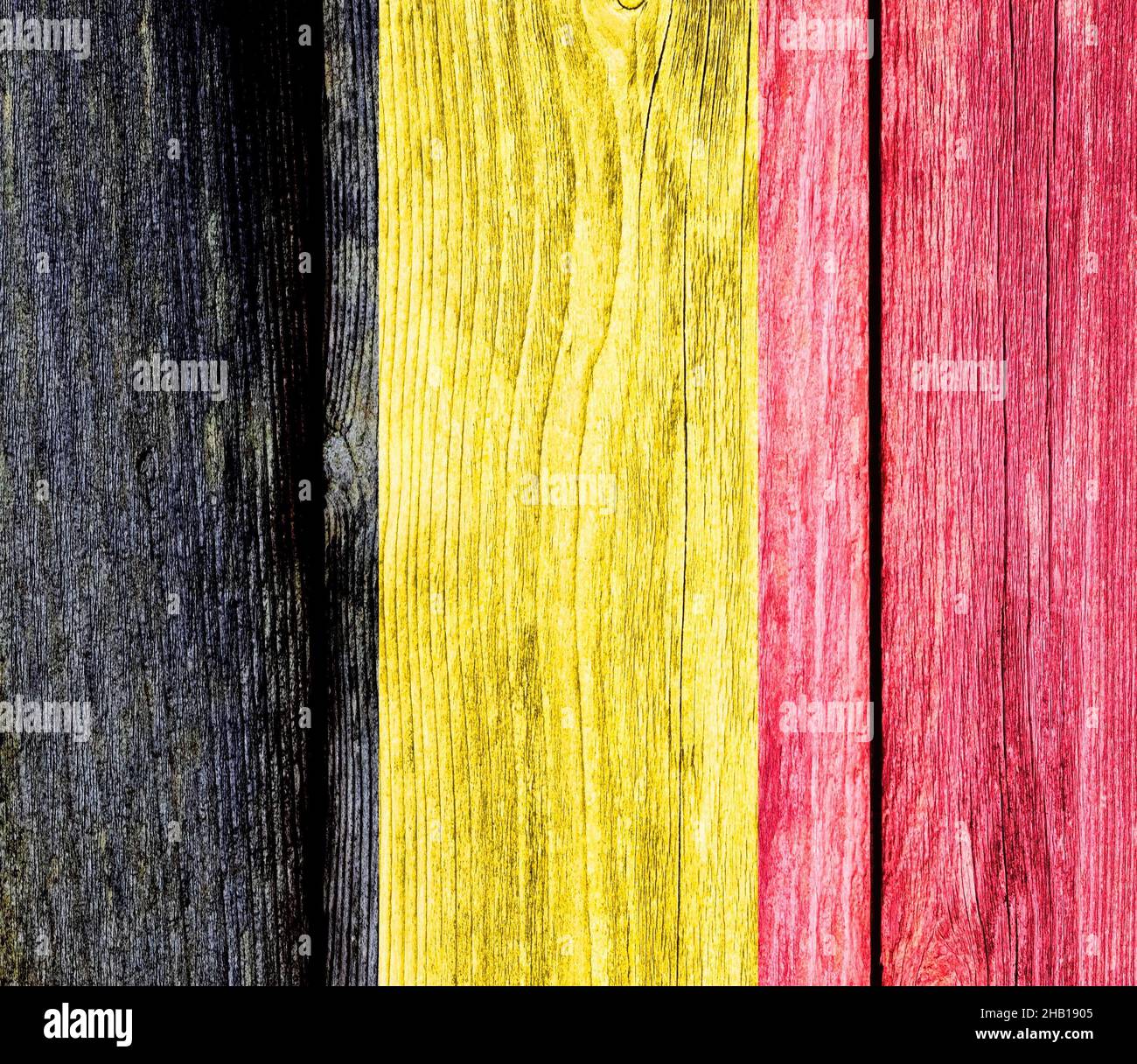 Grunge pattern of Belgium national flag isolated on weathered wooden ...
