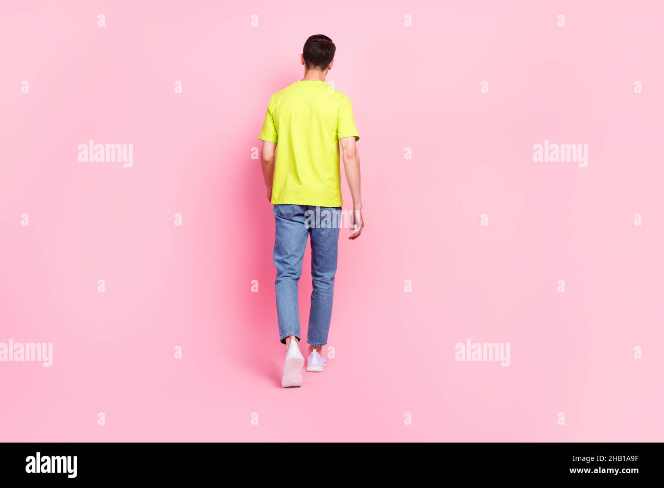 Full length body size back view photo man in casual outfit walking ...