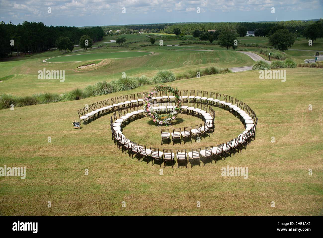 Unique round spiral chair pattern wedding ceremony setting at rolling ...