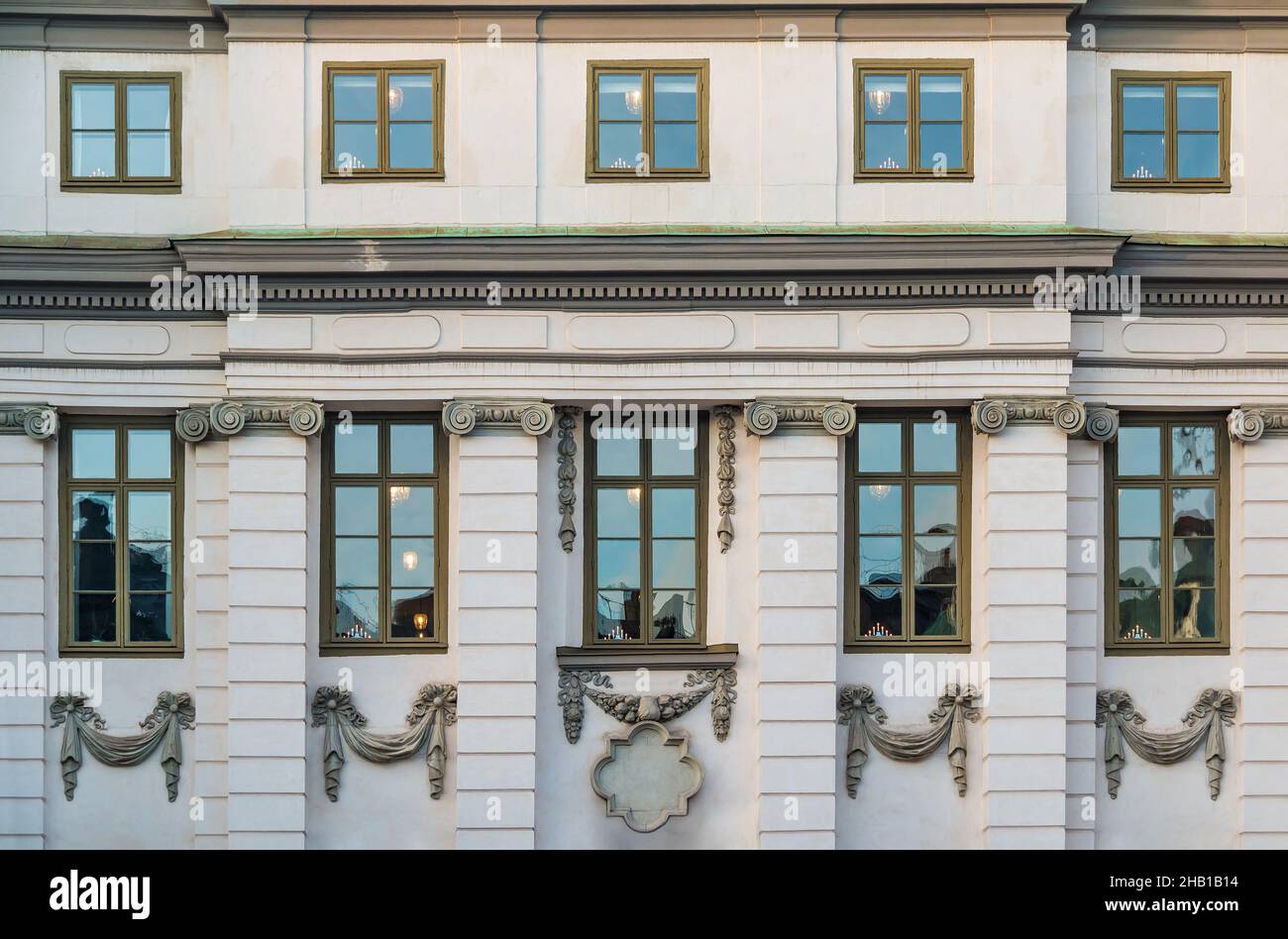 Many windows on facade of the urban historic building front view ...