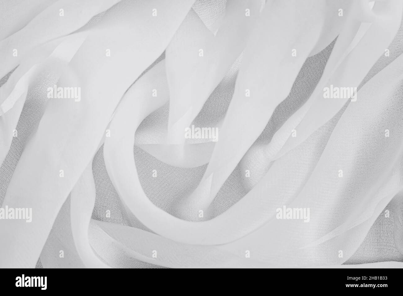 Abstract light background of cloth curled in wavy folds, white gray ...