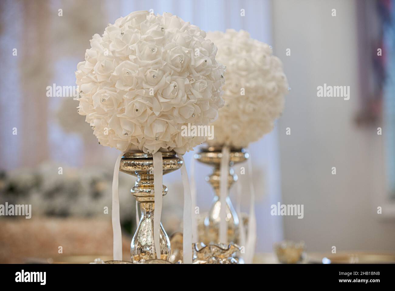 Gold table centerpieces with white ball flowers with diamonds Stock ...