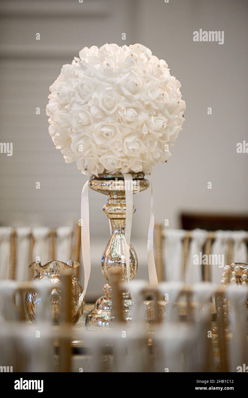 Gold table centerpieces with white ball flowers with diamonds Stock ...