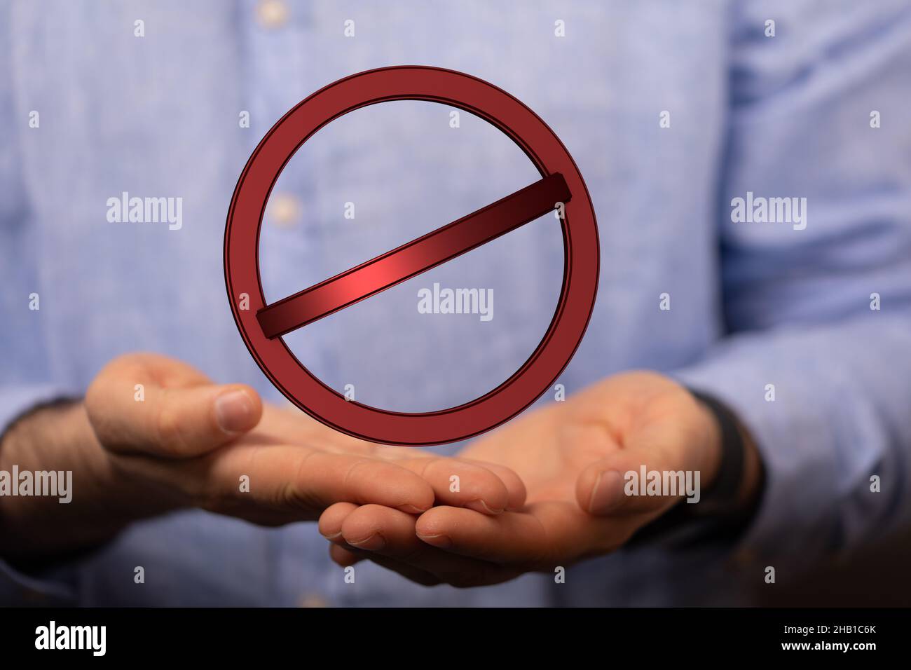 3D rendered prohibition sign in a person's hand Stock Photo - Alamy