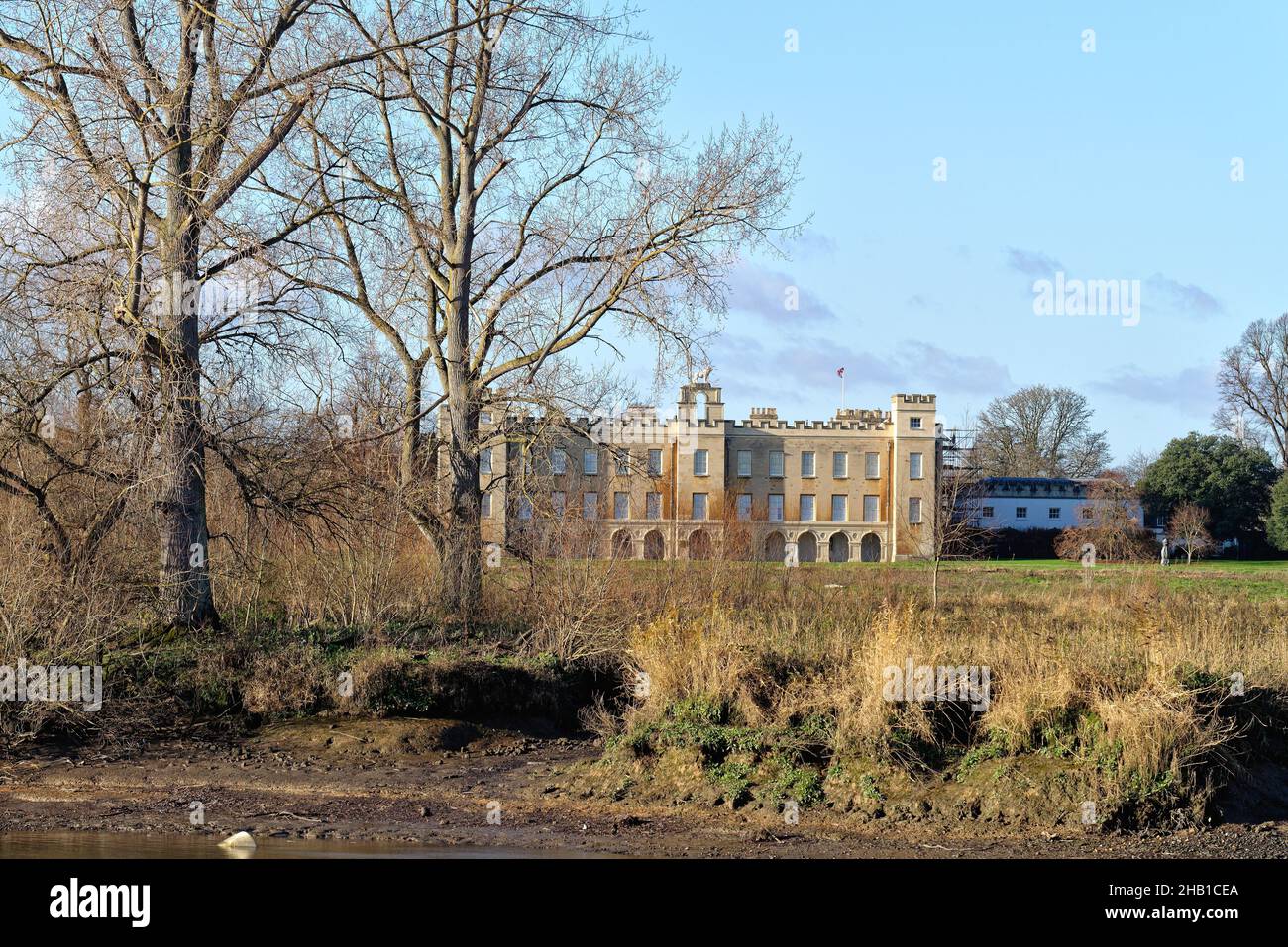 Syon House viewed from across the River Thames on a sunny winters day ...