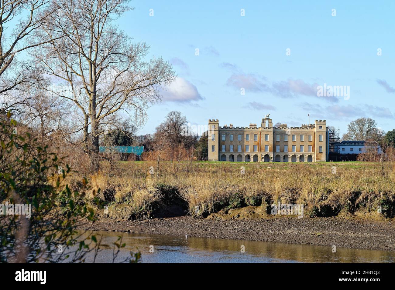 Syon House viewed from across the River Thames on a sunny winters day ...