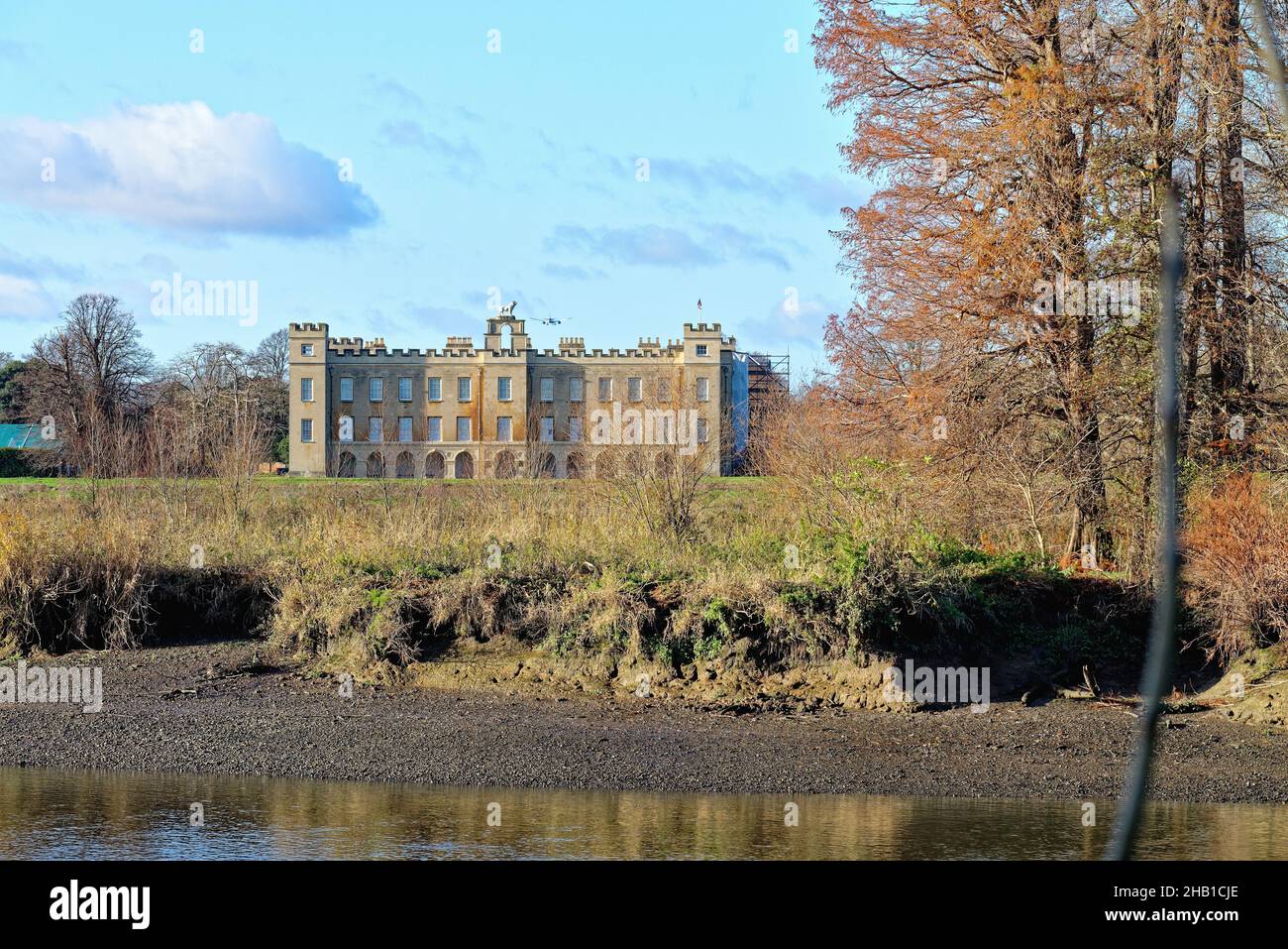 Syon House viewed from across the River Thames on a sunny winters day ...