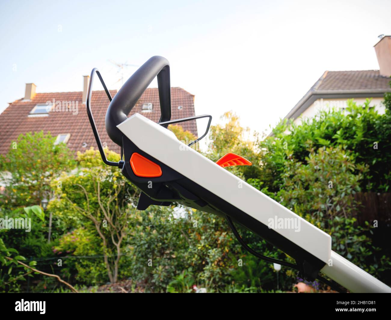 Side view of lawn mower handle with multiple buttons Stock Photo - Alamy