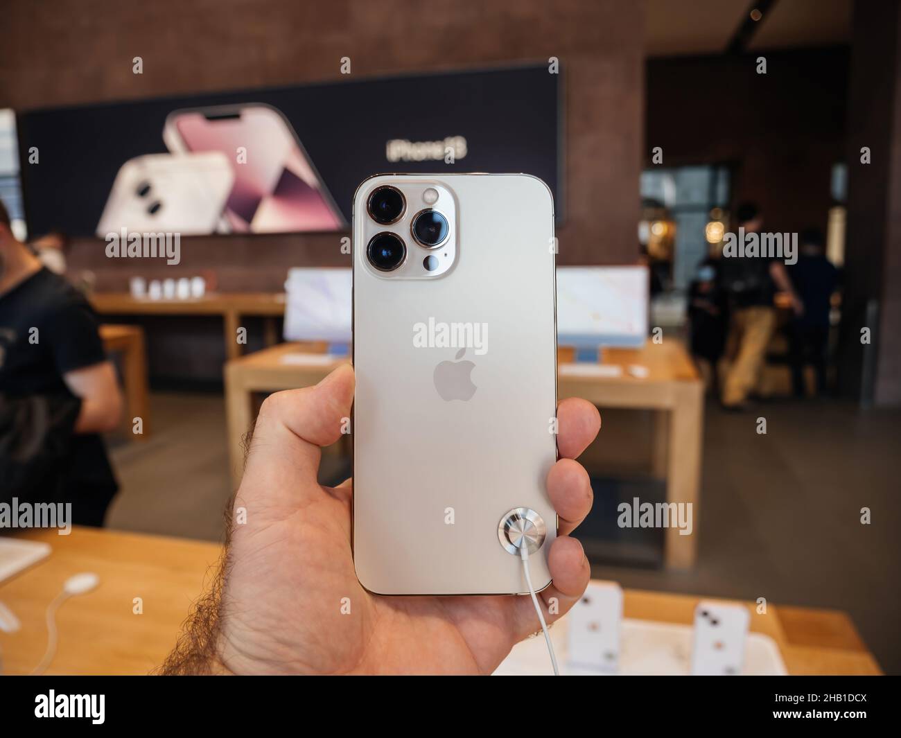 hand holding latest gold iphpne 13 Pro professional Max version inside ...