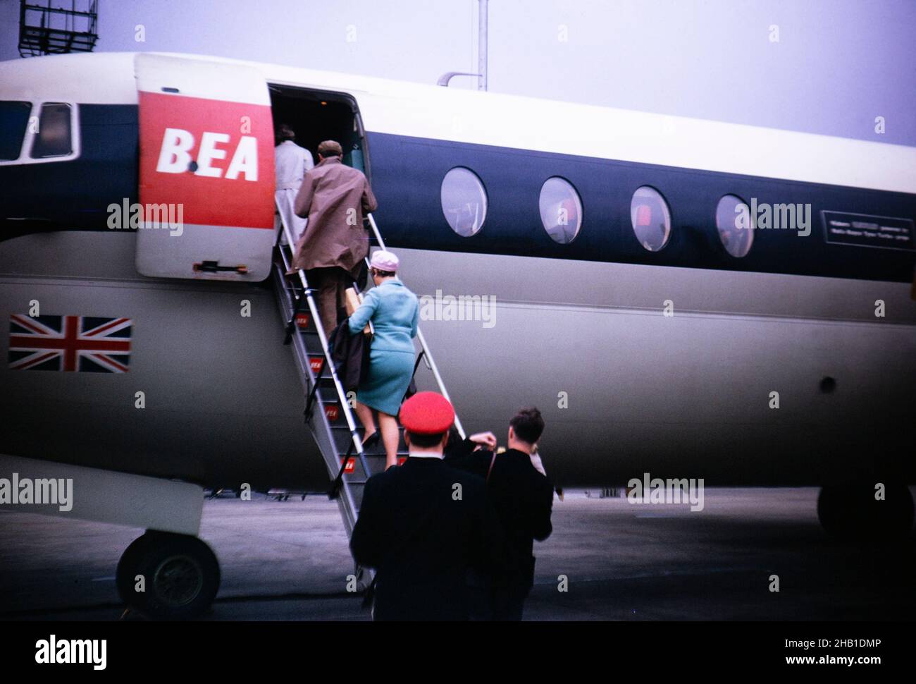 Passengers climbing steps boarding a BEA plane, 1966 Stock Photo - Alamy