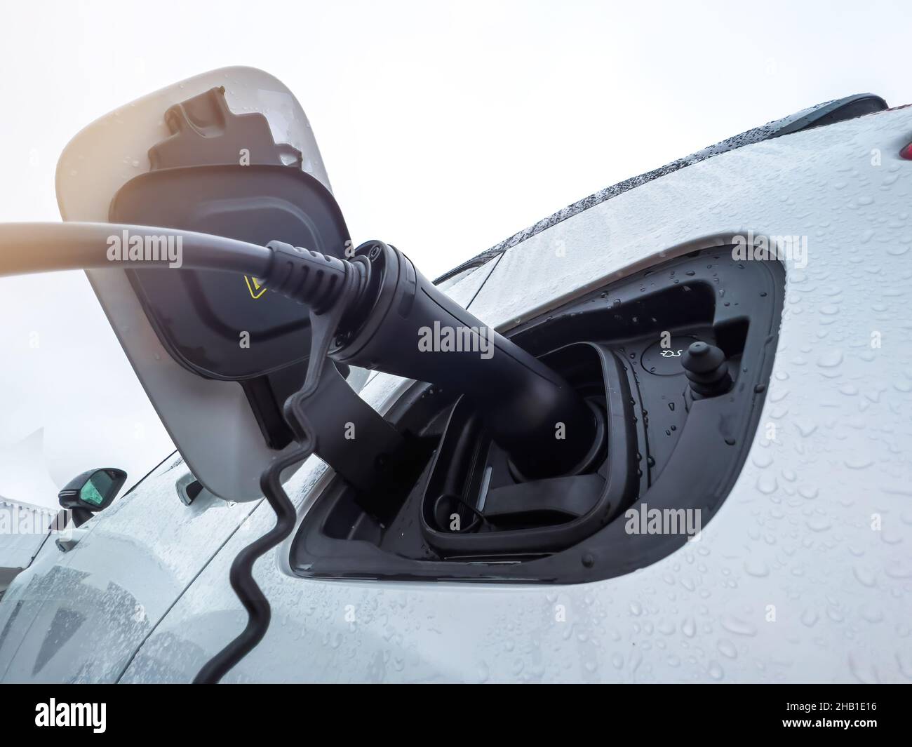 Electric vehicle charging with plug power connected on charger Stock ...
