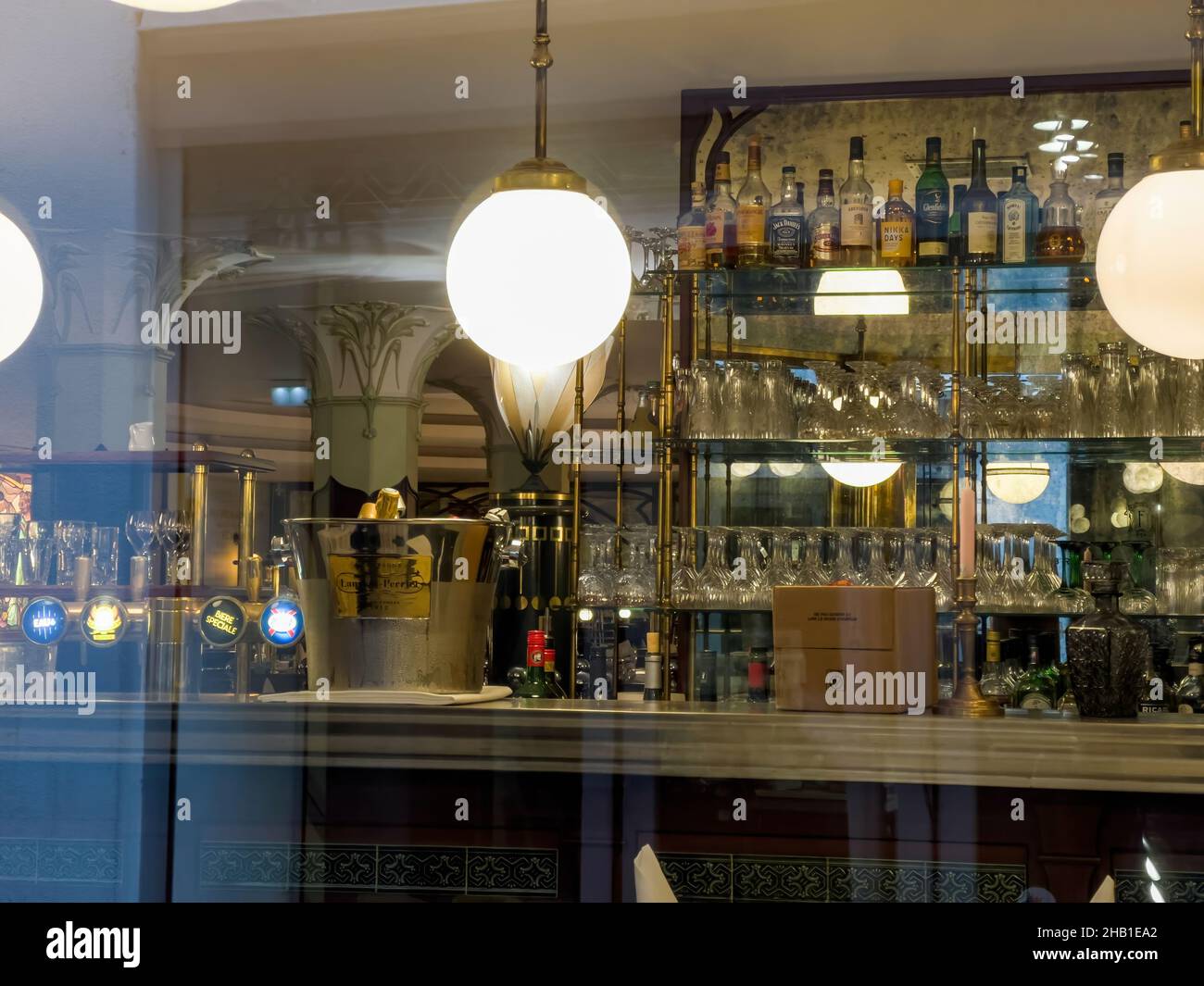 Empty bar counter of Flo restaurant with interior seen through glass ...