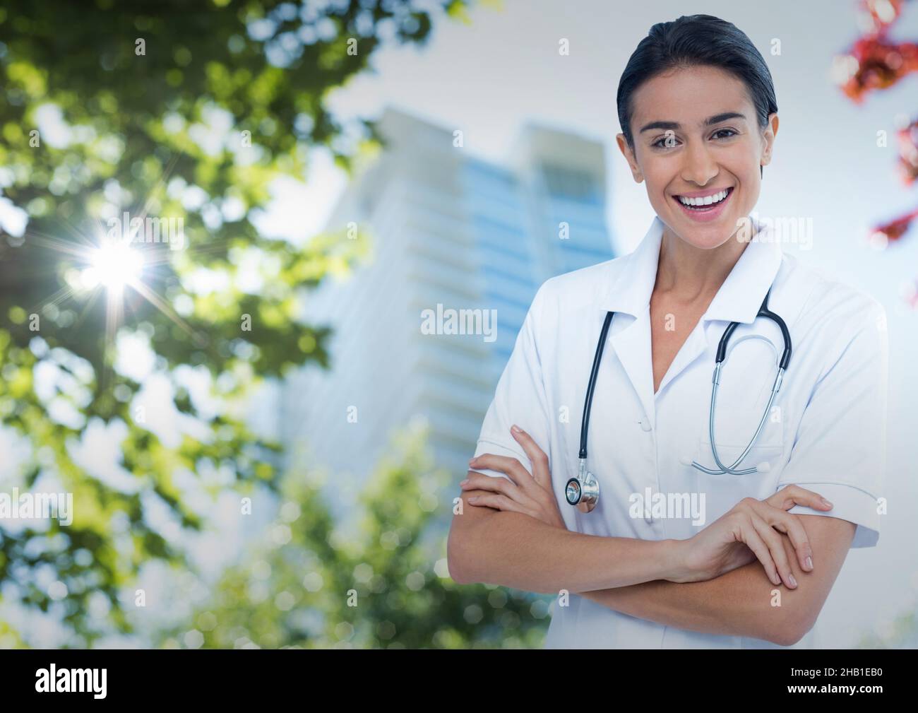 Composite image of caucasian female doctor against tall buildings in ...