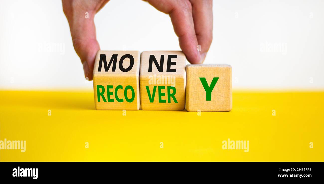 Money recovery symbol. Businessman turns wooden cubes and changes the ...