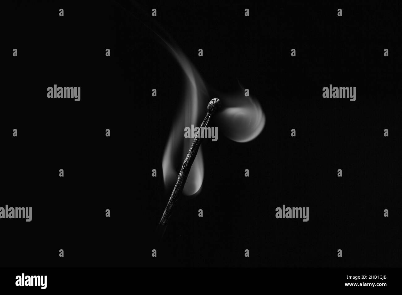 Smoking match on dark background Stock Photo - Alamy